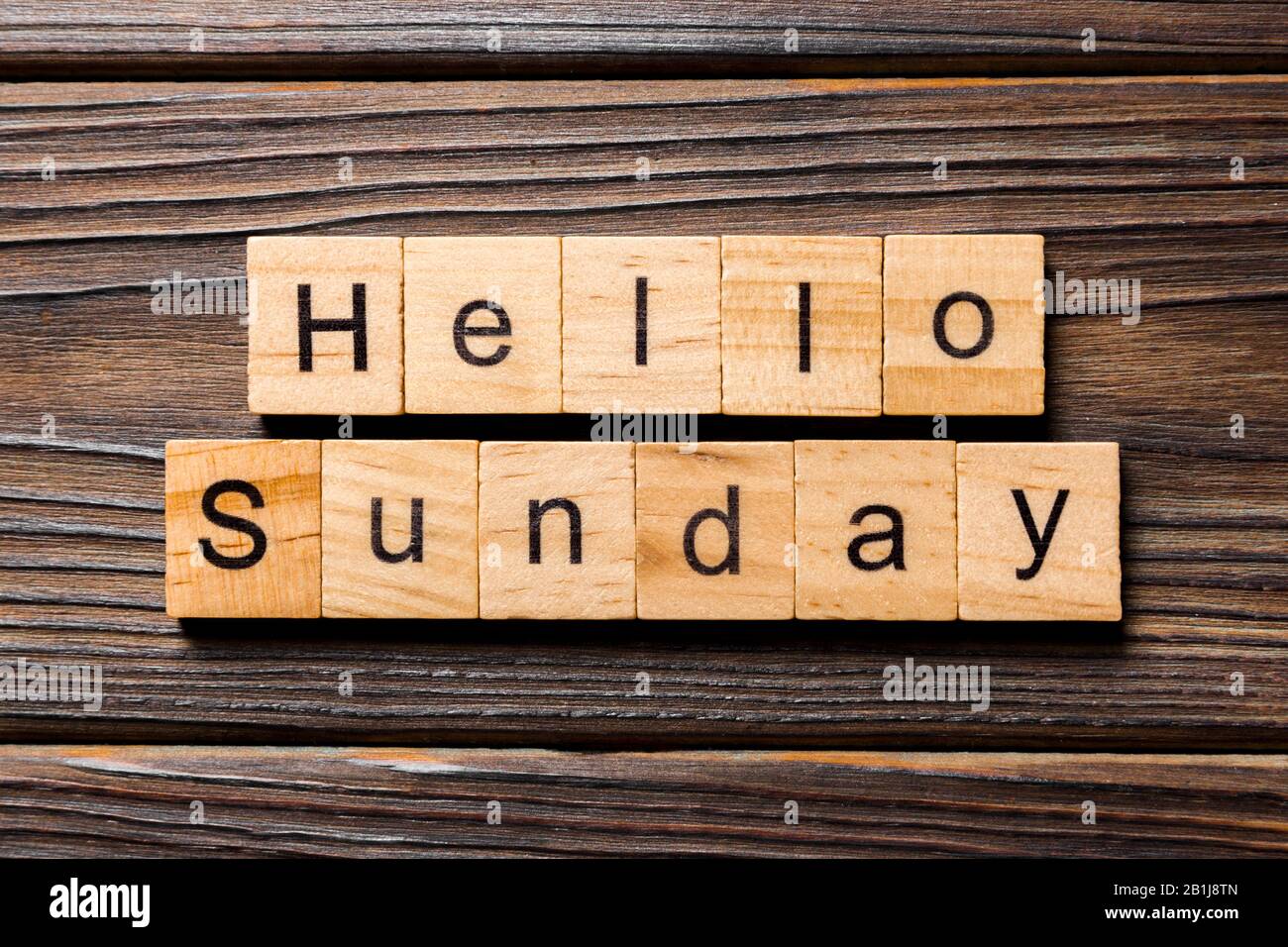 hello sunday word written on wood block. hello sunday text on wooden ...