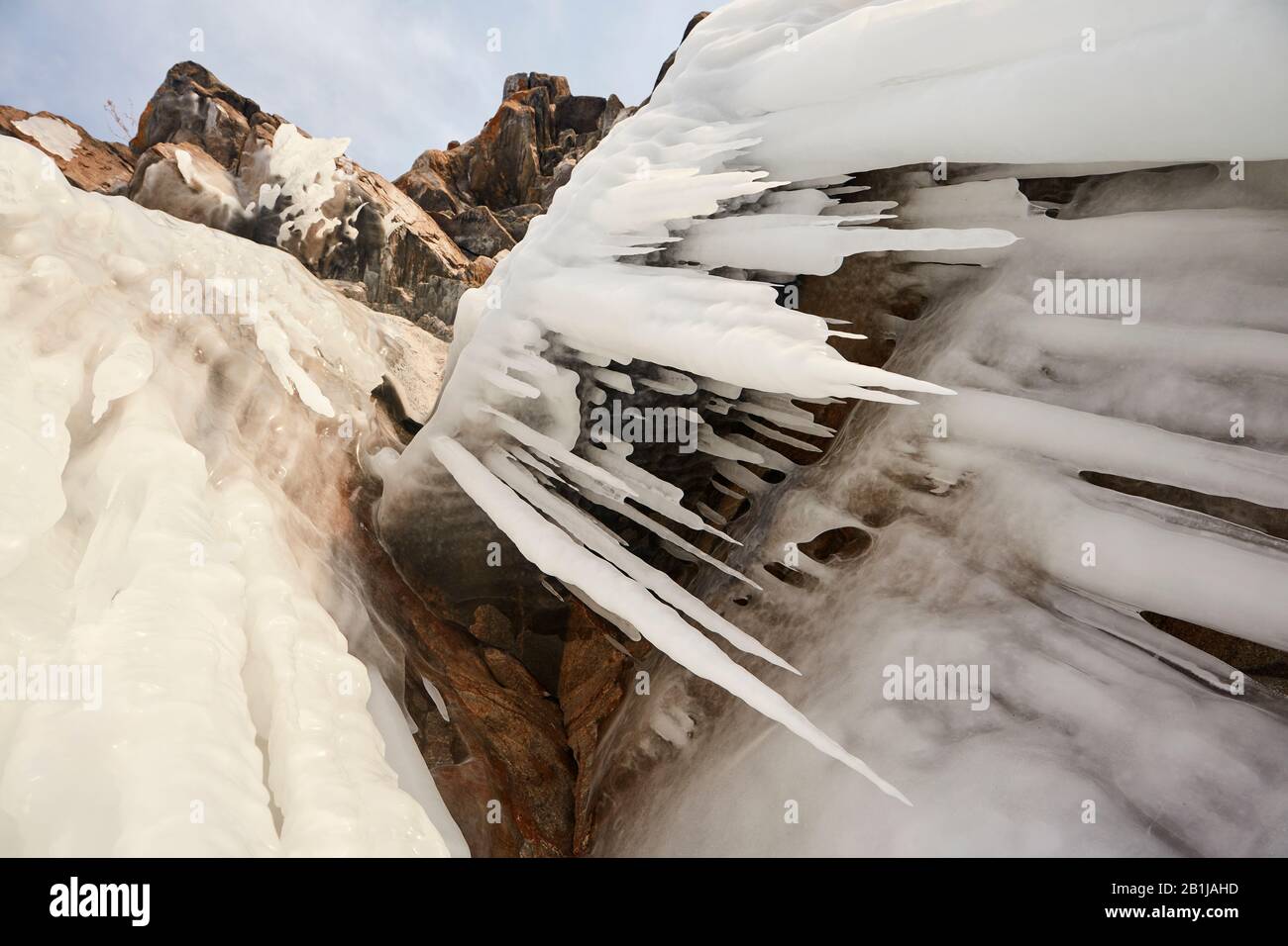 Frozen spray on rock walls Stock Photo - Alamy