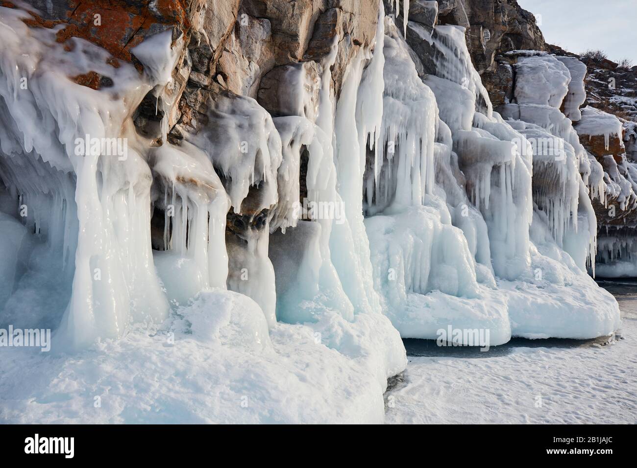 Frozen spray on rock walls Stock Photo - Alamy