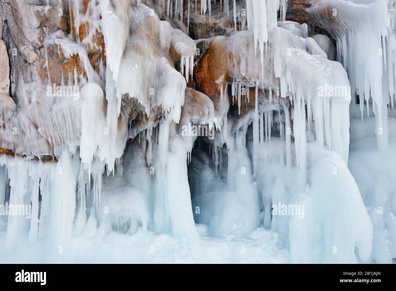 Frozen spray on rock walls Stock Photo - Alamy