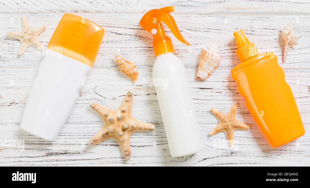 banner flat lay concept summer travel vacation. Sunscreen bottles with ...