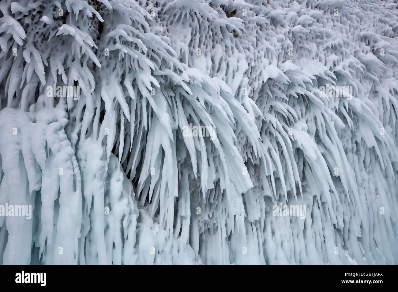 Frozen spray on rock walls Stock Photo - Alamy