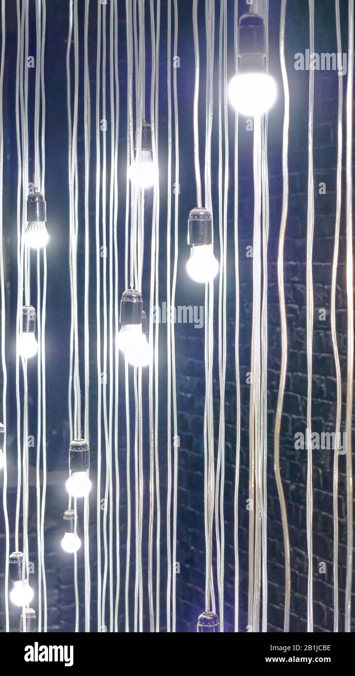 bright white bulbs hanging on transparently glowing wires Stock Photo ...