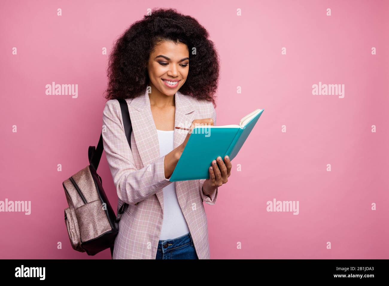 Photo of funny pretty dark skin student lady writing copybook lesson ...
