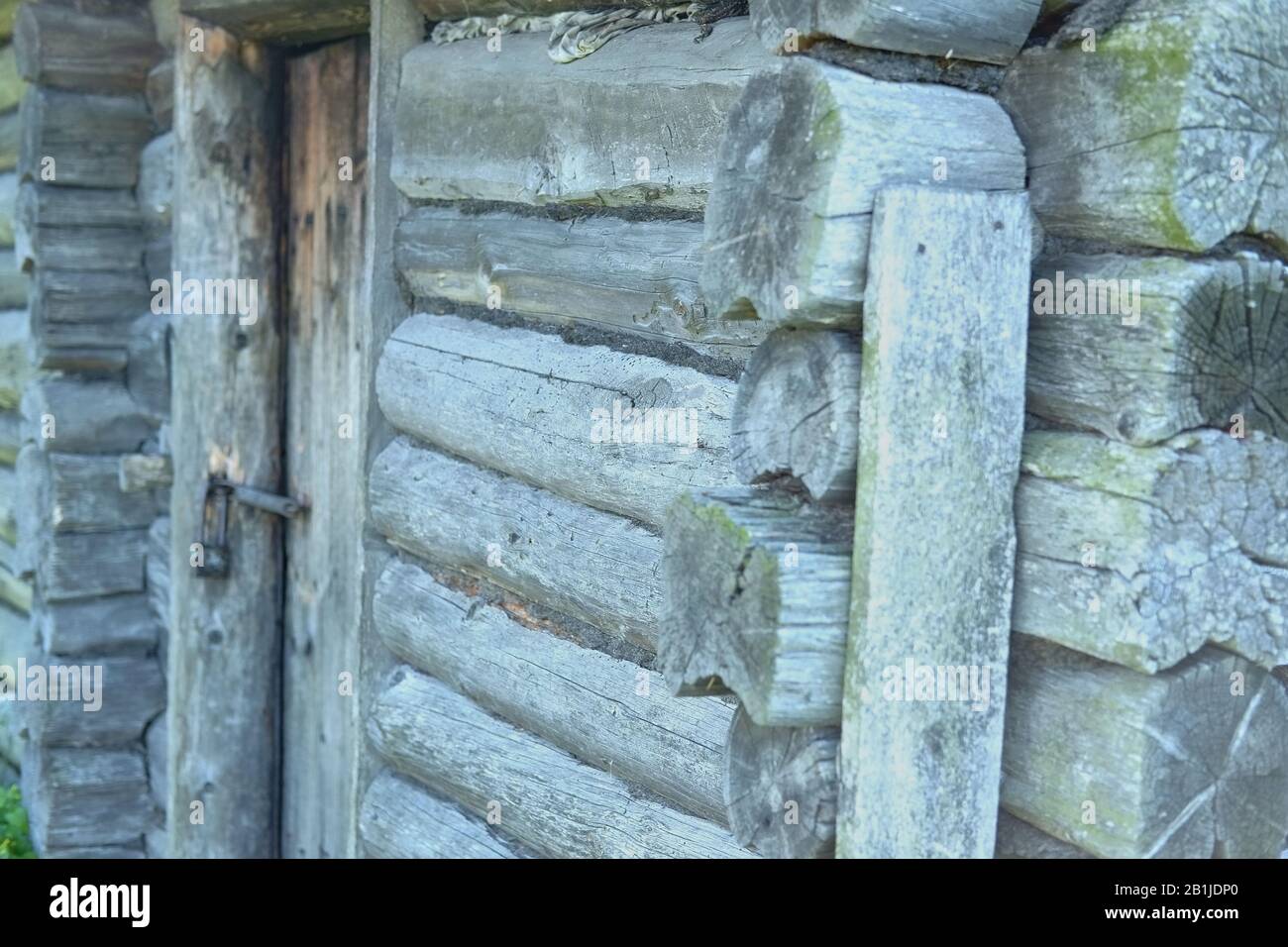 The wall with the door of the log hut Stock Photo - Alamy