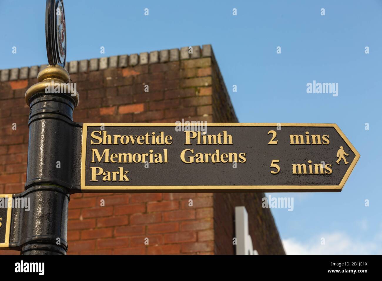 Signpost pointing to the Shrovetide Plinth. Ashbourne, Derbyshire Stock ...