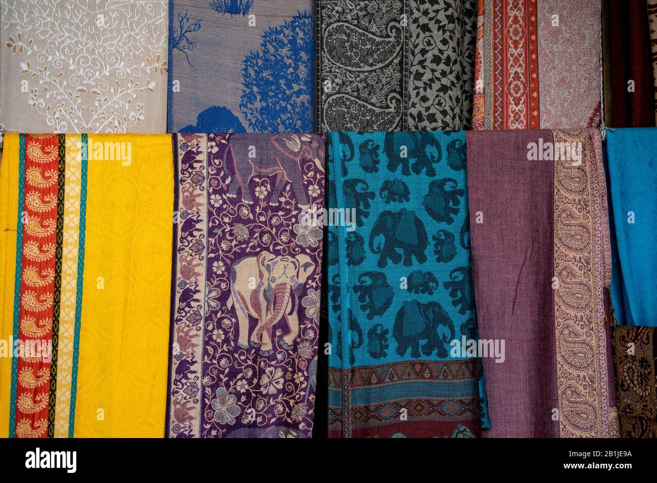 Scarves for sale at a market in Rishikesh India, with colorful designs ...