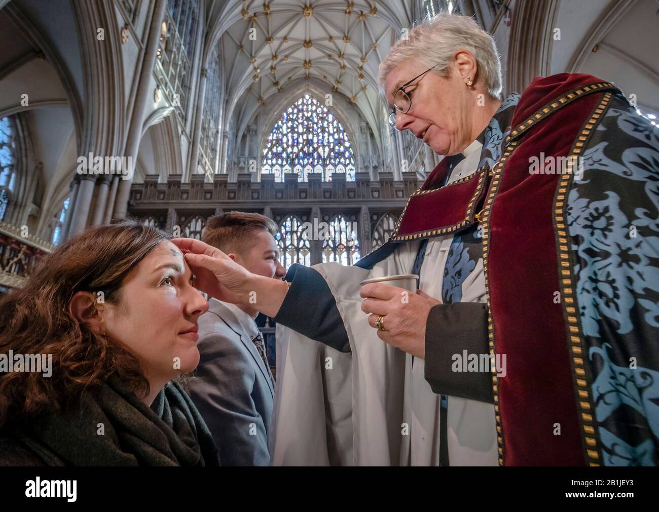 York Minster staff Lisa Power and Danny Knight receive the sign of the ...