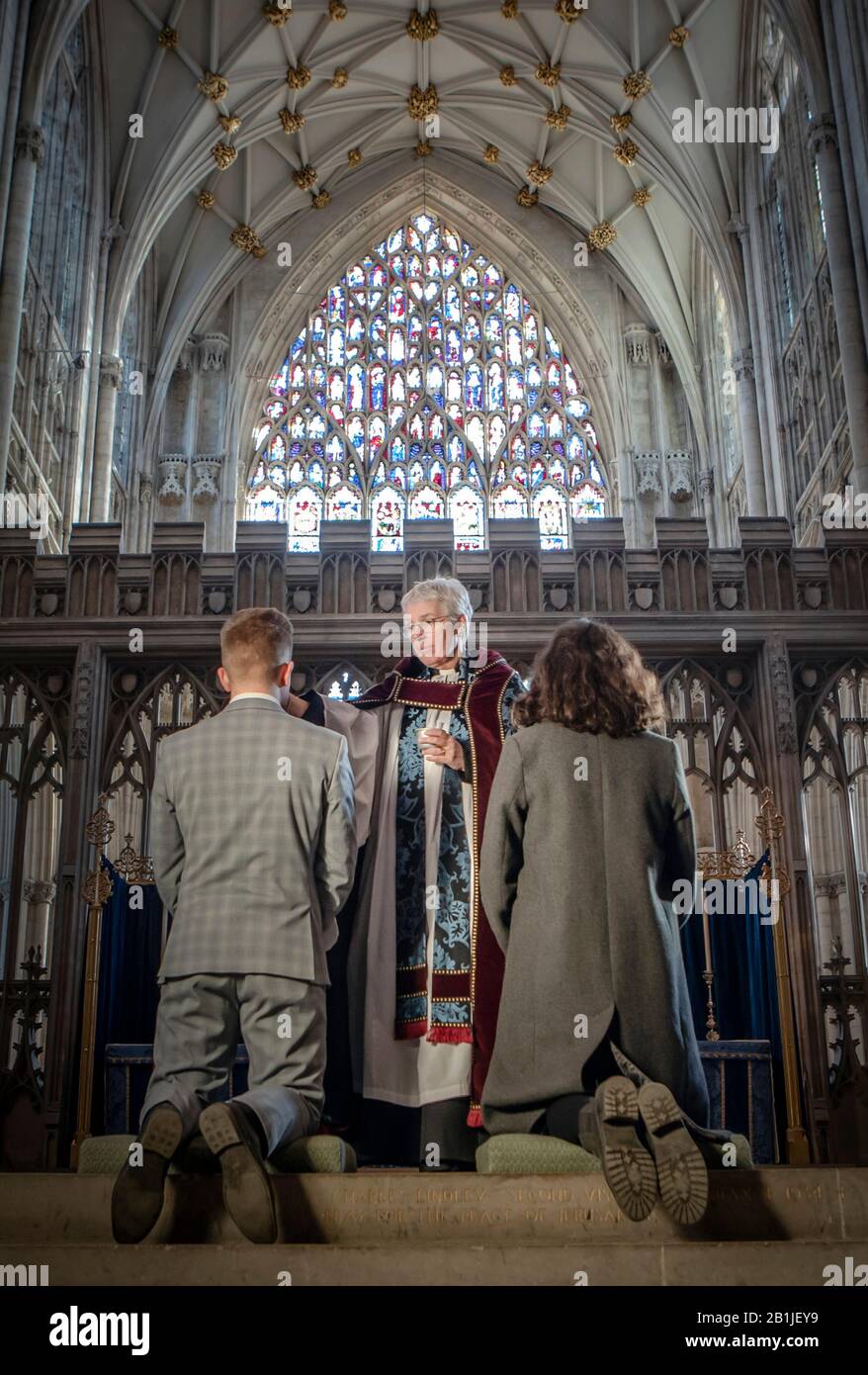 York Minster staff Lisa Power and Danny Knight receive the sign of the ...