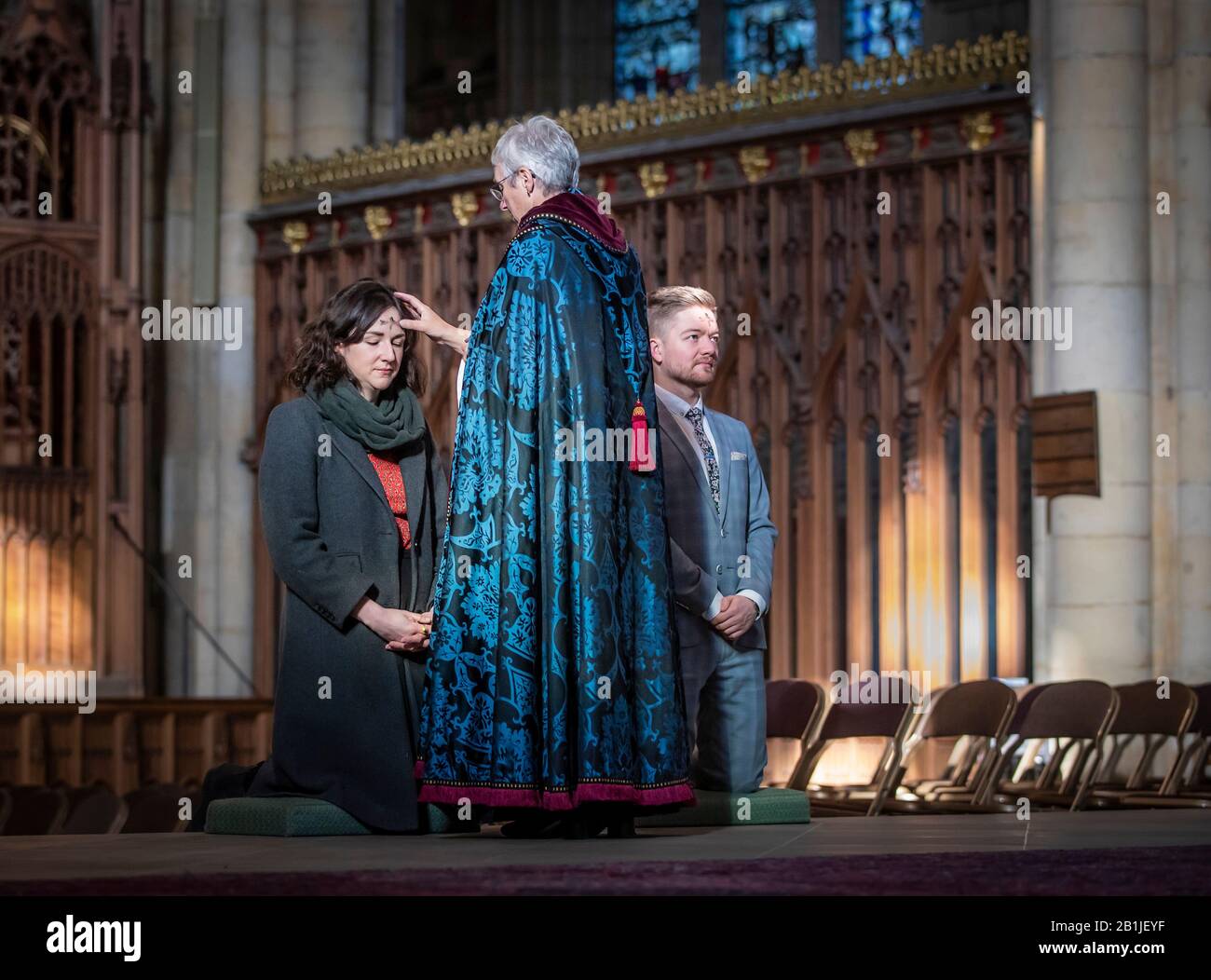 York Minster staff Lisa Power and Danny Knight receive the sign of the ...