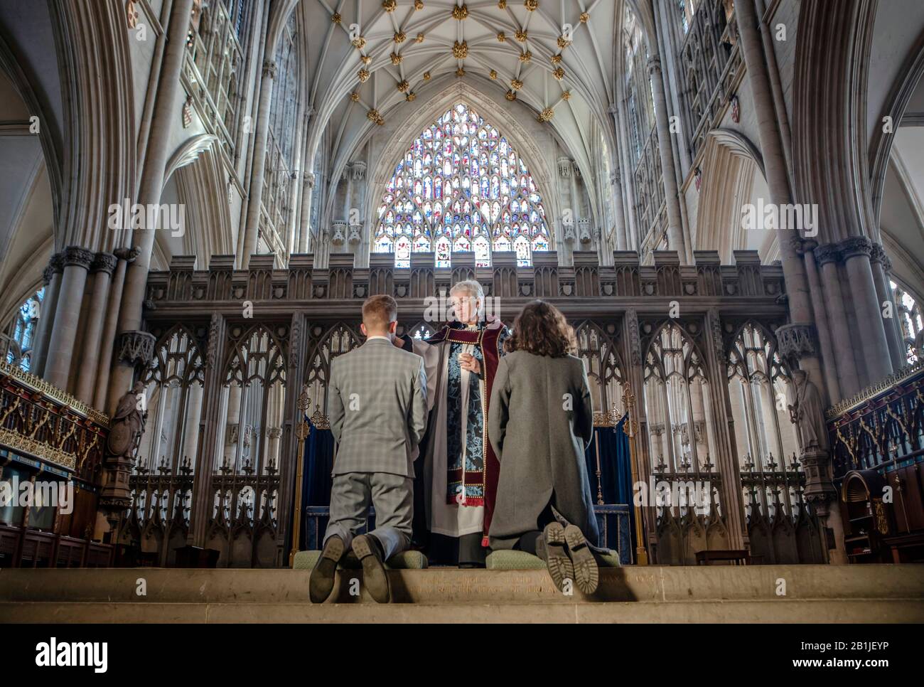 York Minster staff Lisa Power and Danny Knight receive the sign of the ...