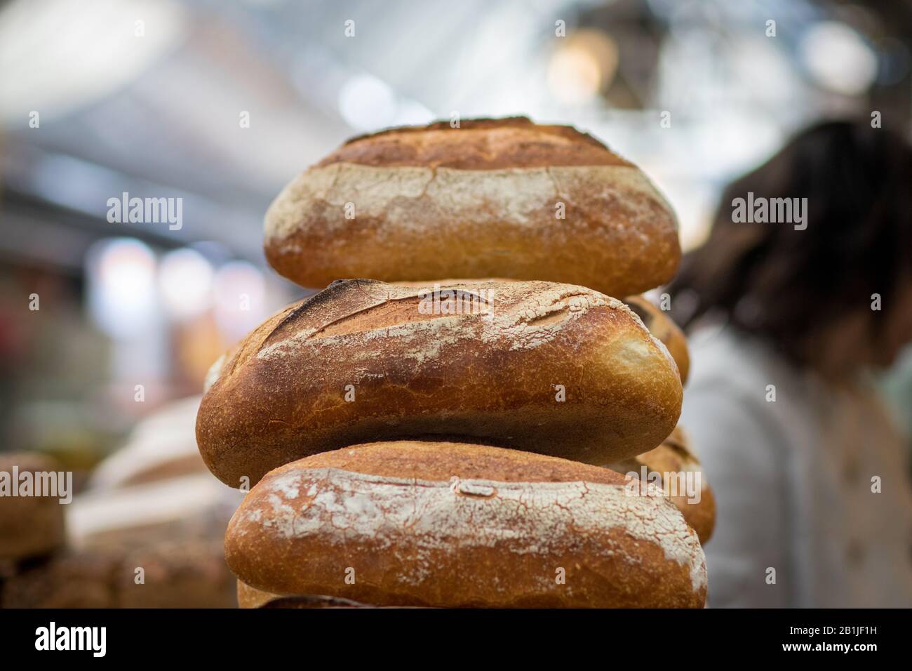 A pile of fresh bread made from whole flour. Crispy, blurred background ...