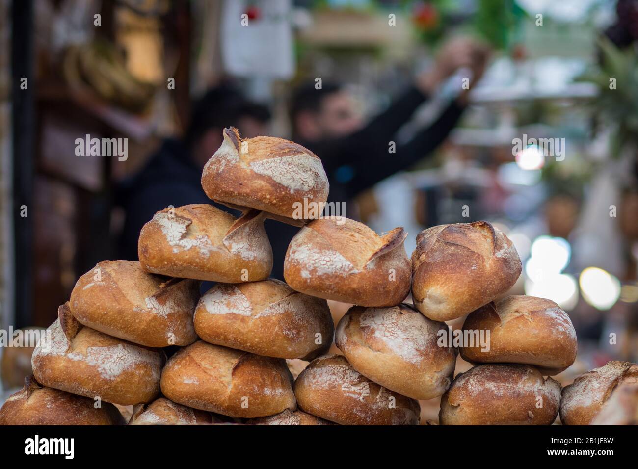 A pile of fresh bread made from whole flour. Crispy, blurred background ...