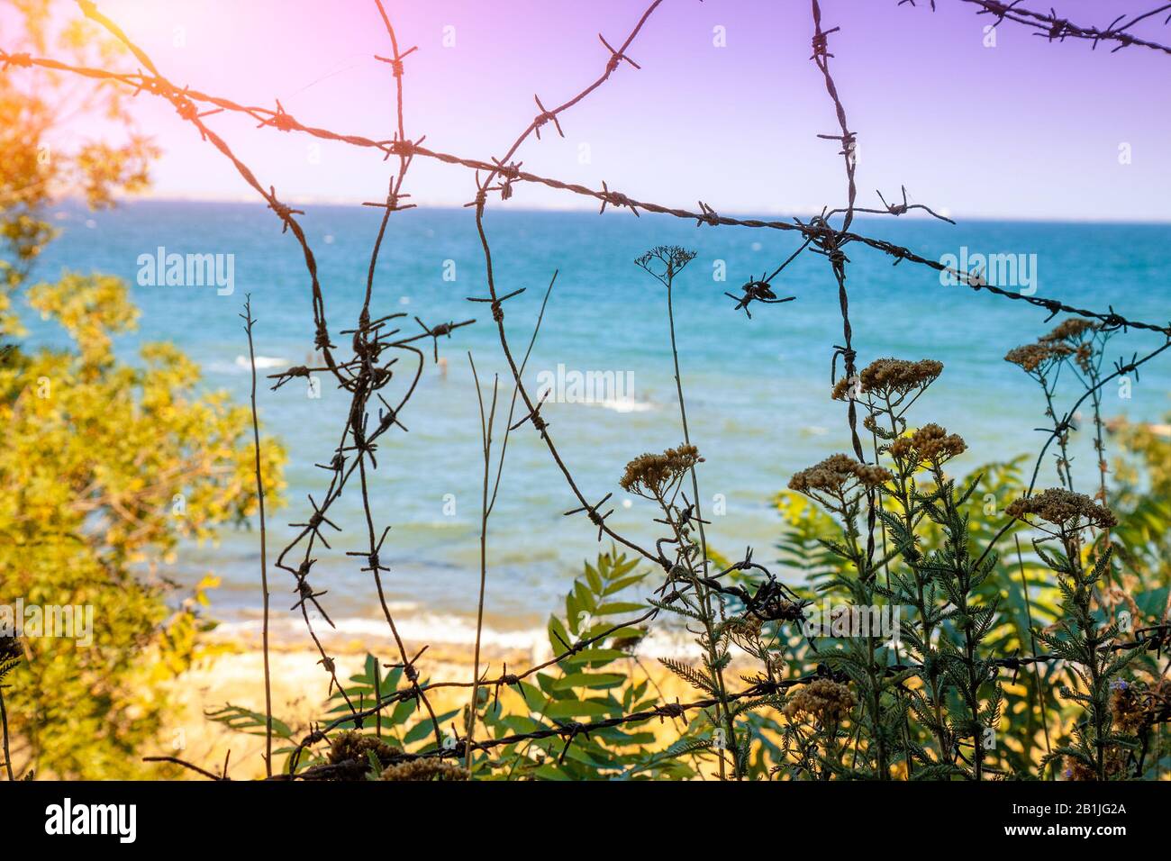 Barbed wire on the beach hi-res stock photography and images - Alamy