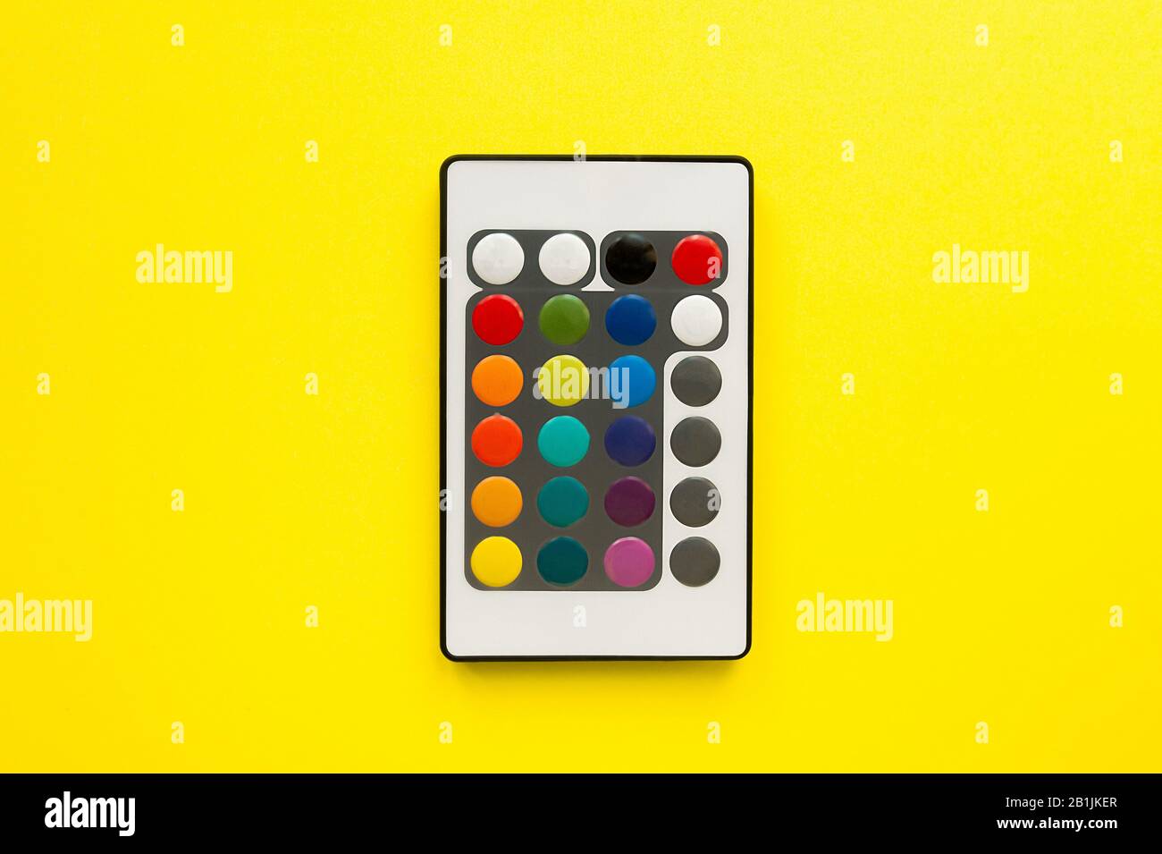 Small unusual control or remote panel with multi-colored buttons on a ...