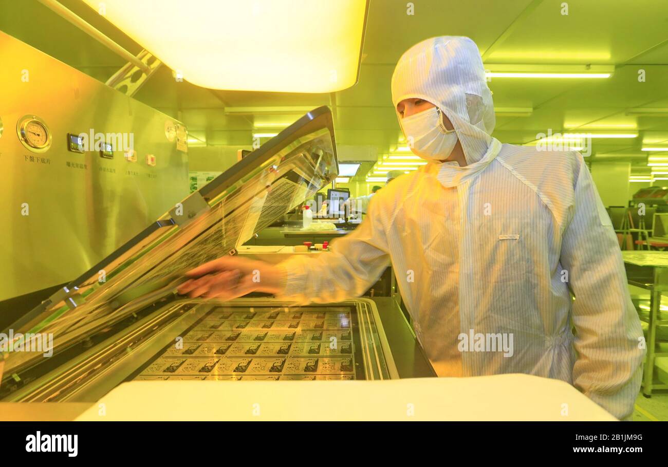 Chinese workers manufacture printed circuit boards (PCB) which are used ...