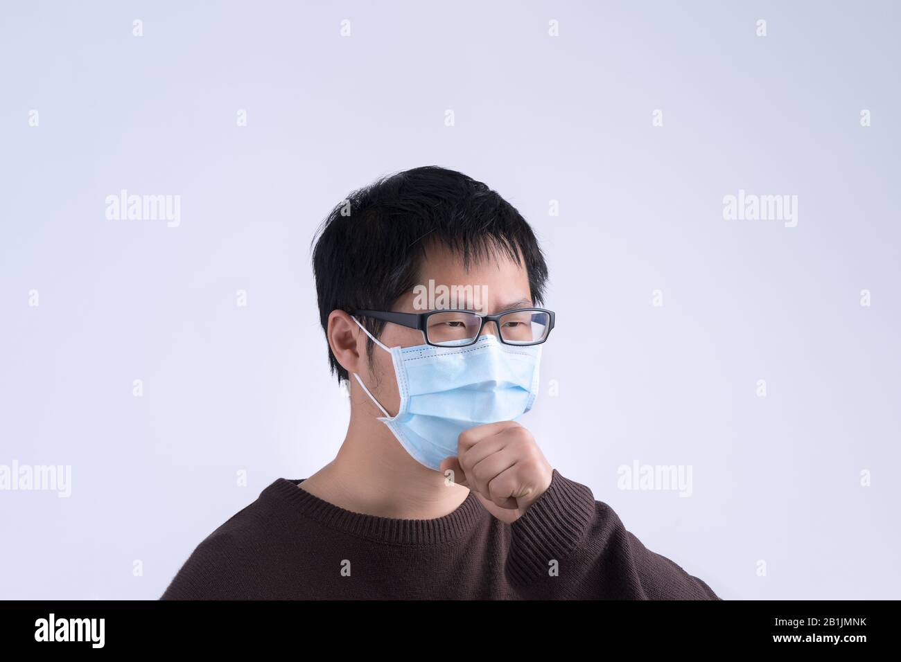 Young Asian man is coughing, feeling unwell, vomit sick with wearing a ...