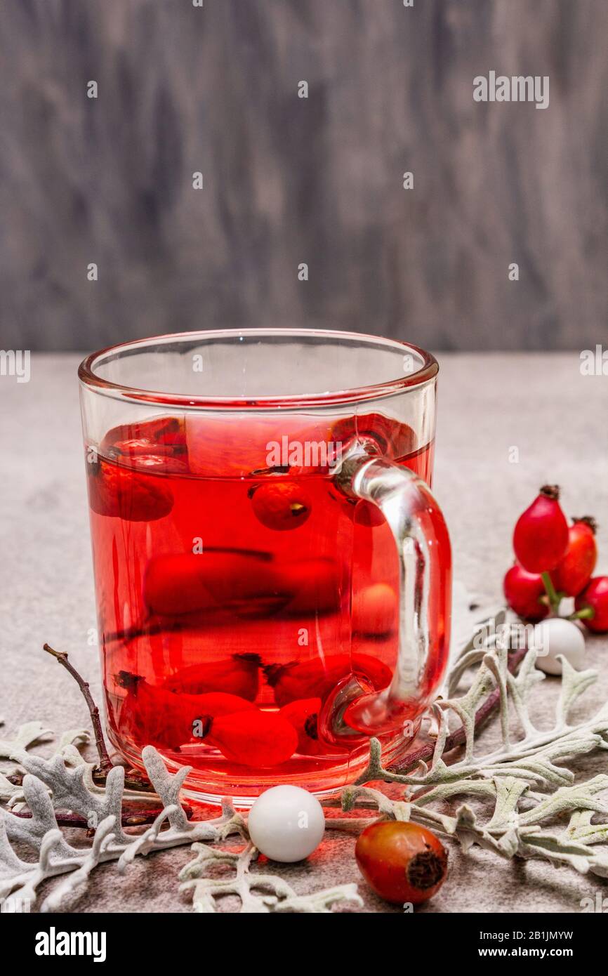 Hot dog-rose tea. Winter drink for good mood with fresh berries, leaves ...