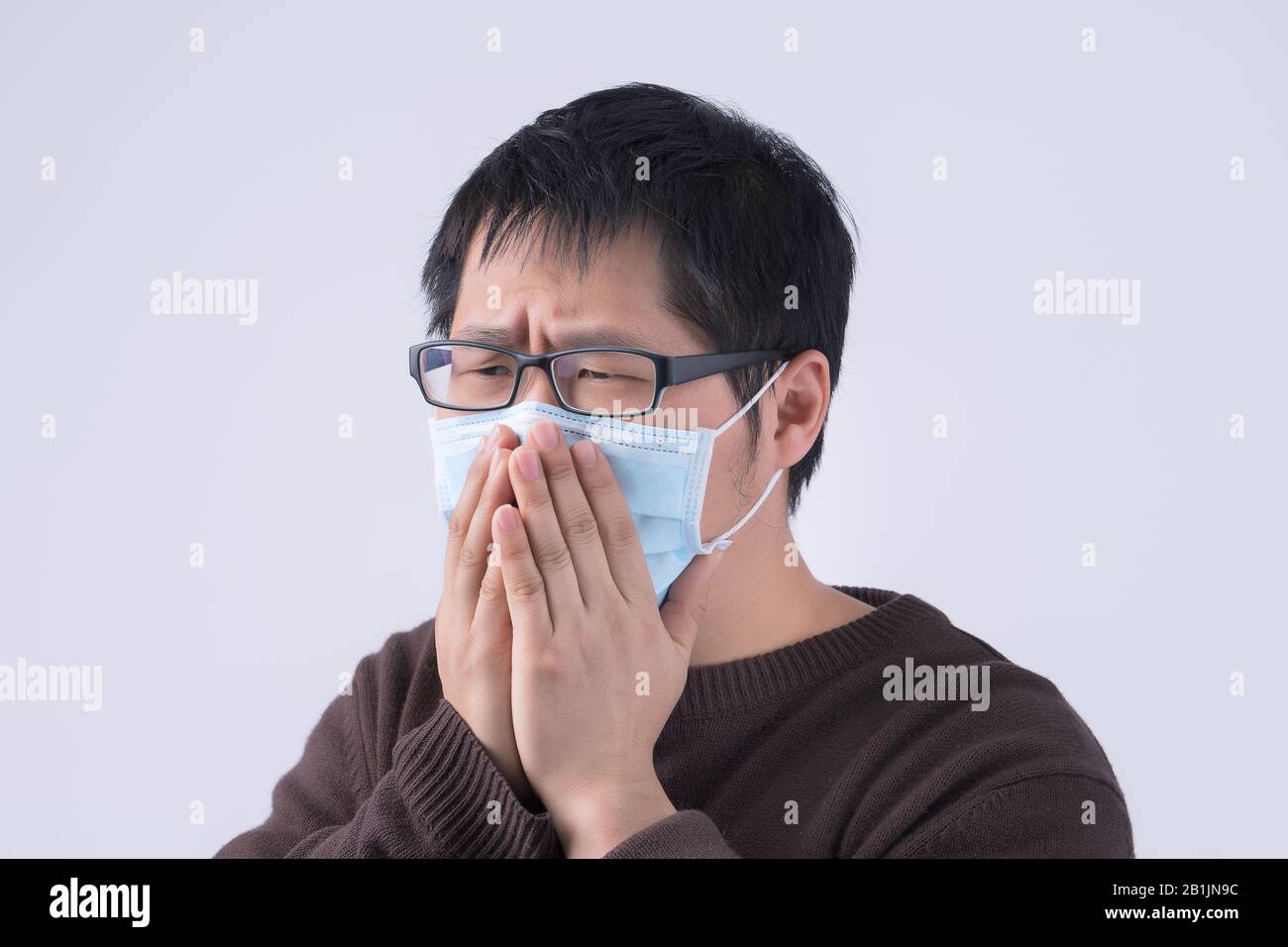 Young Asian man is coughing, feeling unwell, vomit sick with wearing a ...
