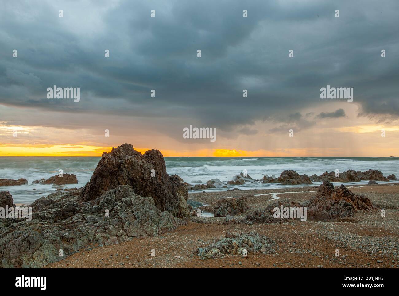 Landscape photograph of a beach scene at sunset Stock Photo - Alamy