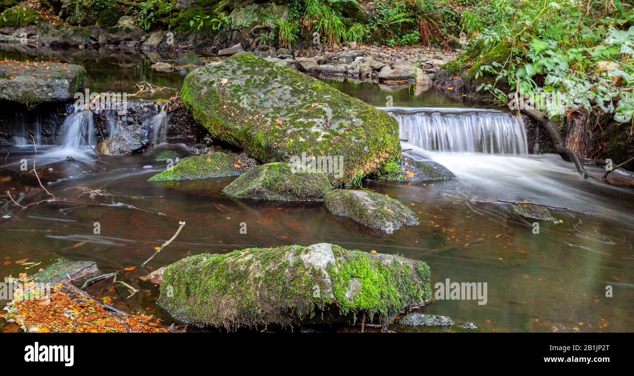 Landscape photograph of a small waterfall Stock Photo - Alamy