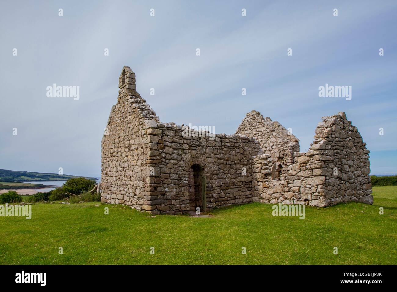 Landscape photograph of a building by the sea Stock Photo - Alamy