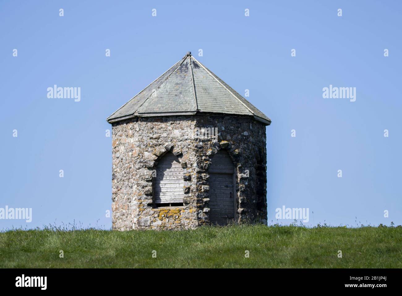 Landscape photograph of a building by the sea Stock Photo - Alamy