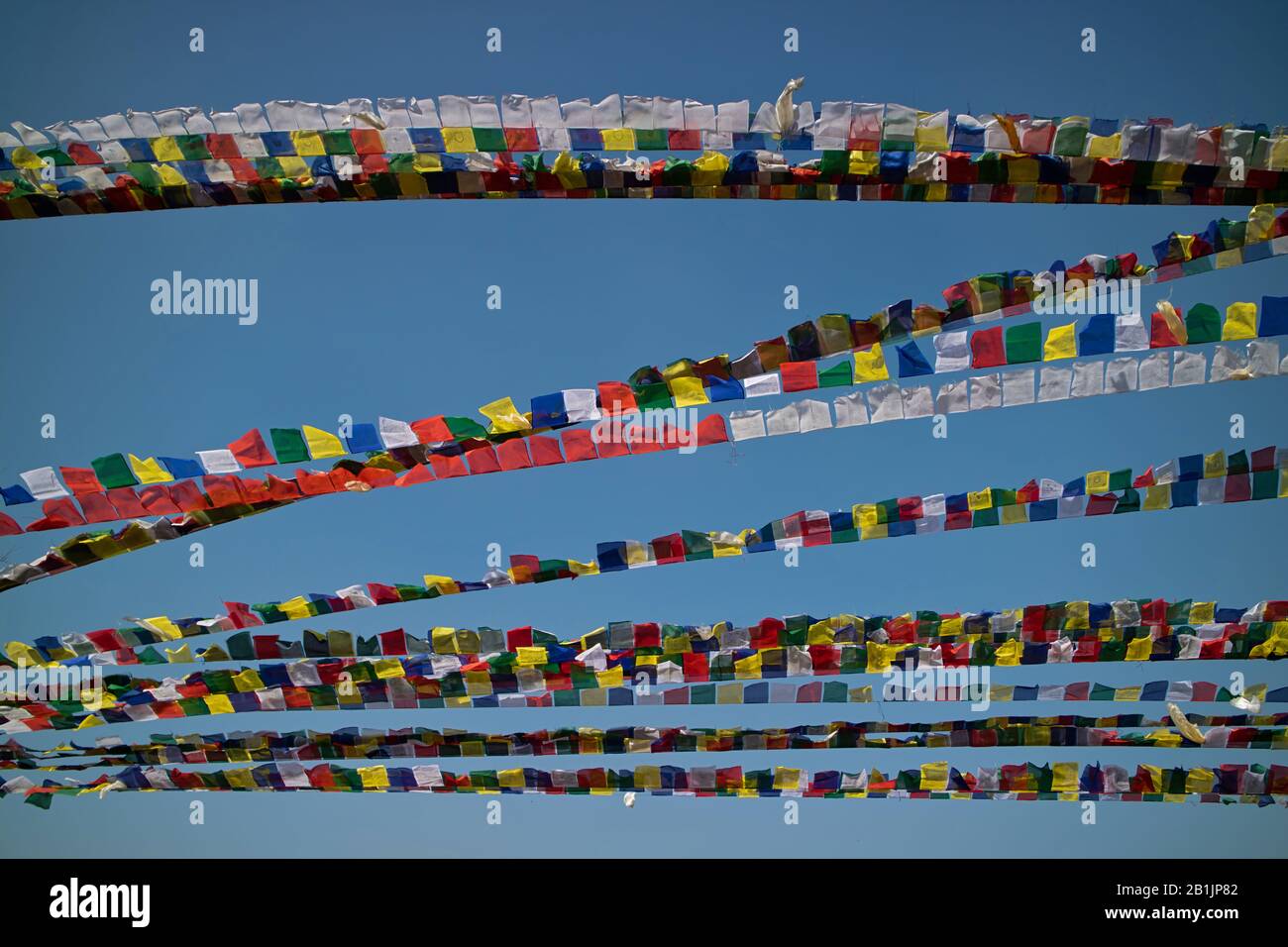 Prayer flags in the wind Stock Photo - Alamy