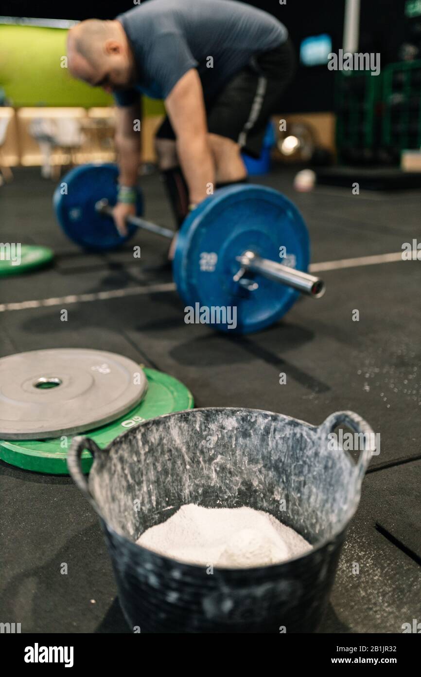 Adult bald man weightlifter exercising in gym Stock Photo - Alamy