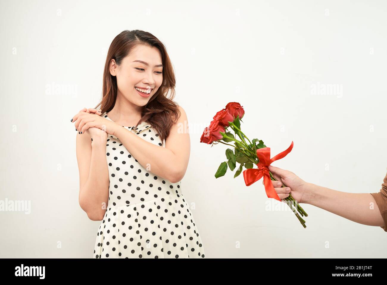 Woman receive red roses hi-res stock photography and images - Alamy