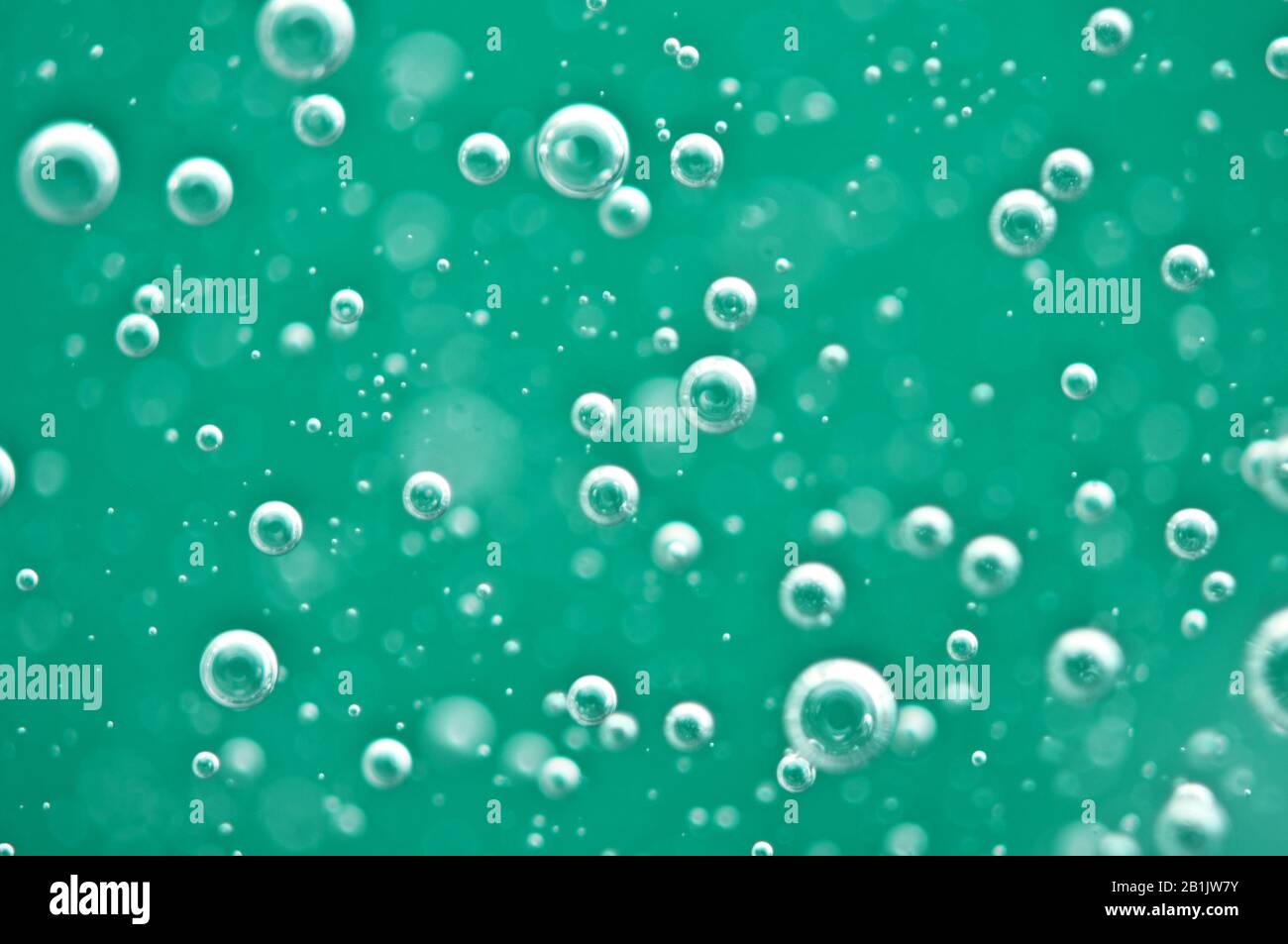 Beautiful turquoise background. Rising air bubbles in clear water. Oxygen. Macro Stock Photo - Alamy