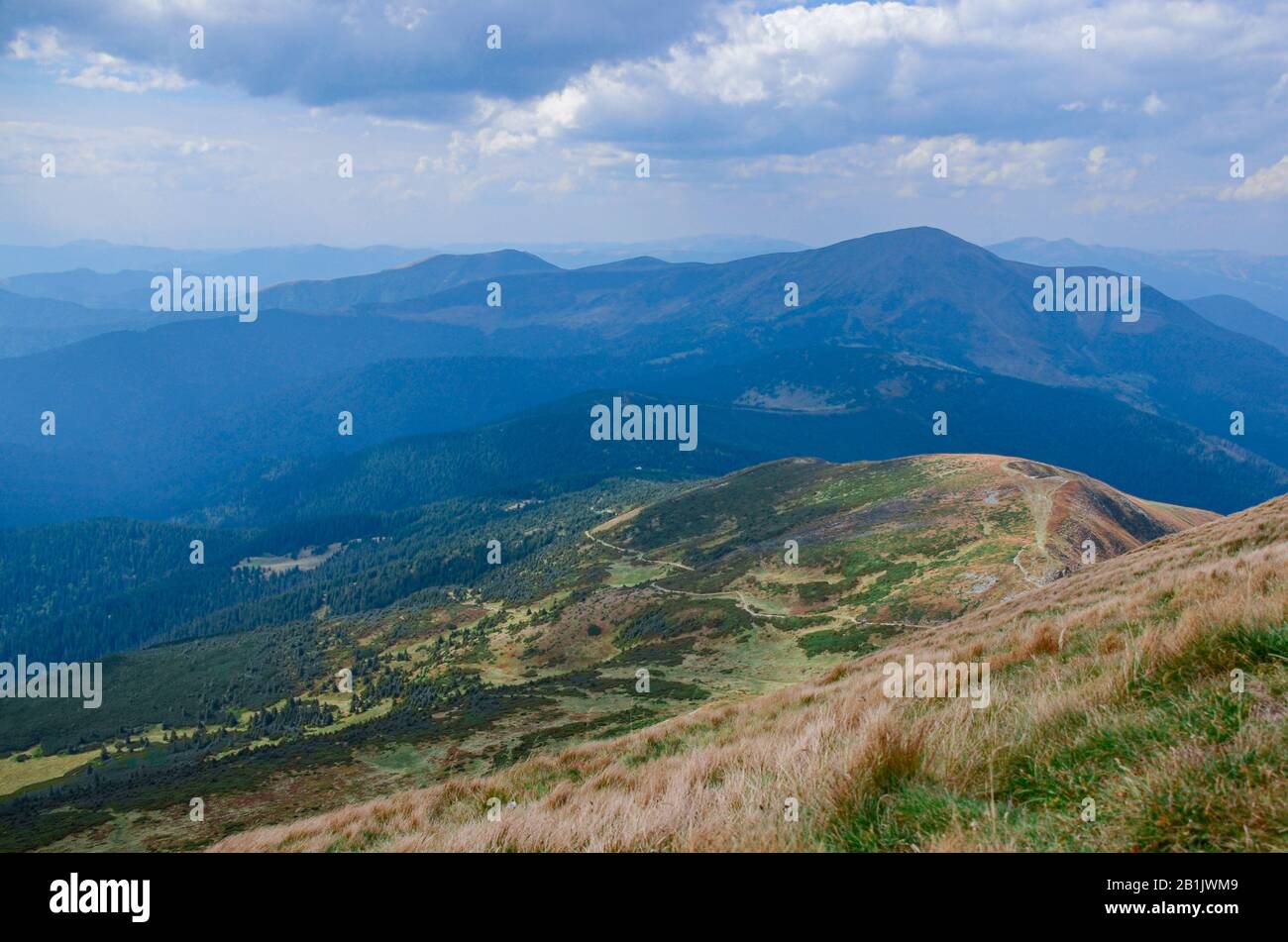 Conquering the mountain peaks. Hike on the mountain hedges of the ...