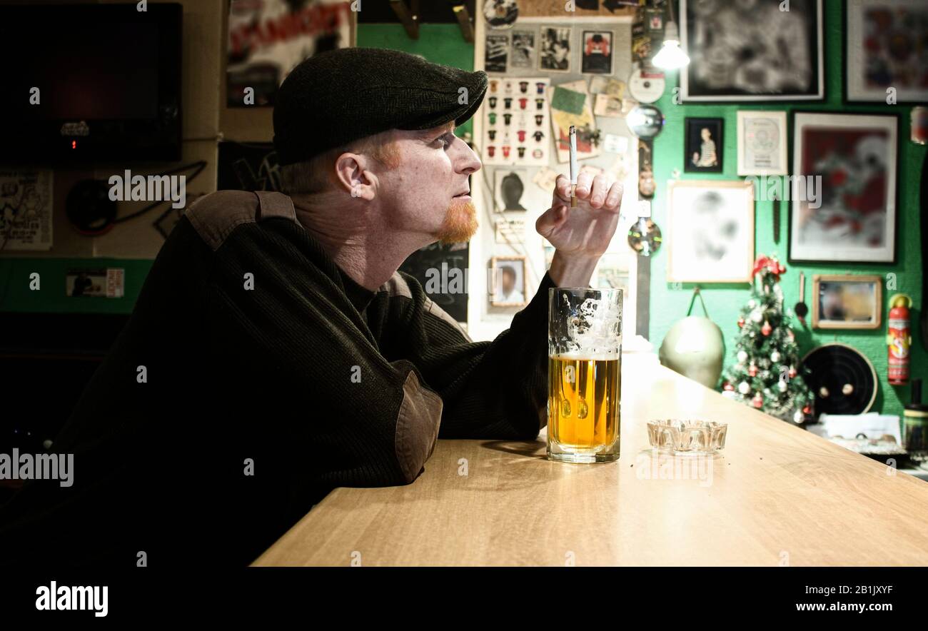 Guy smokes hi-res stock photography and images - Alamy