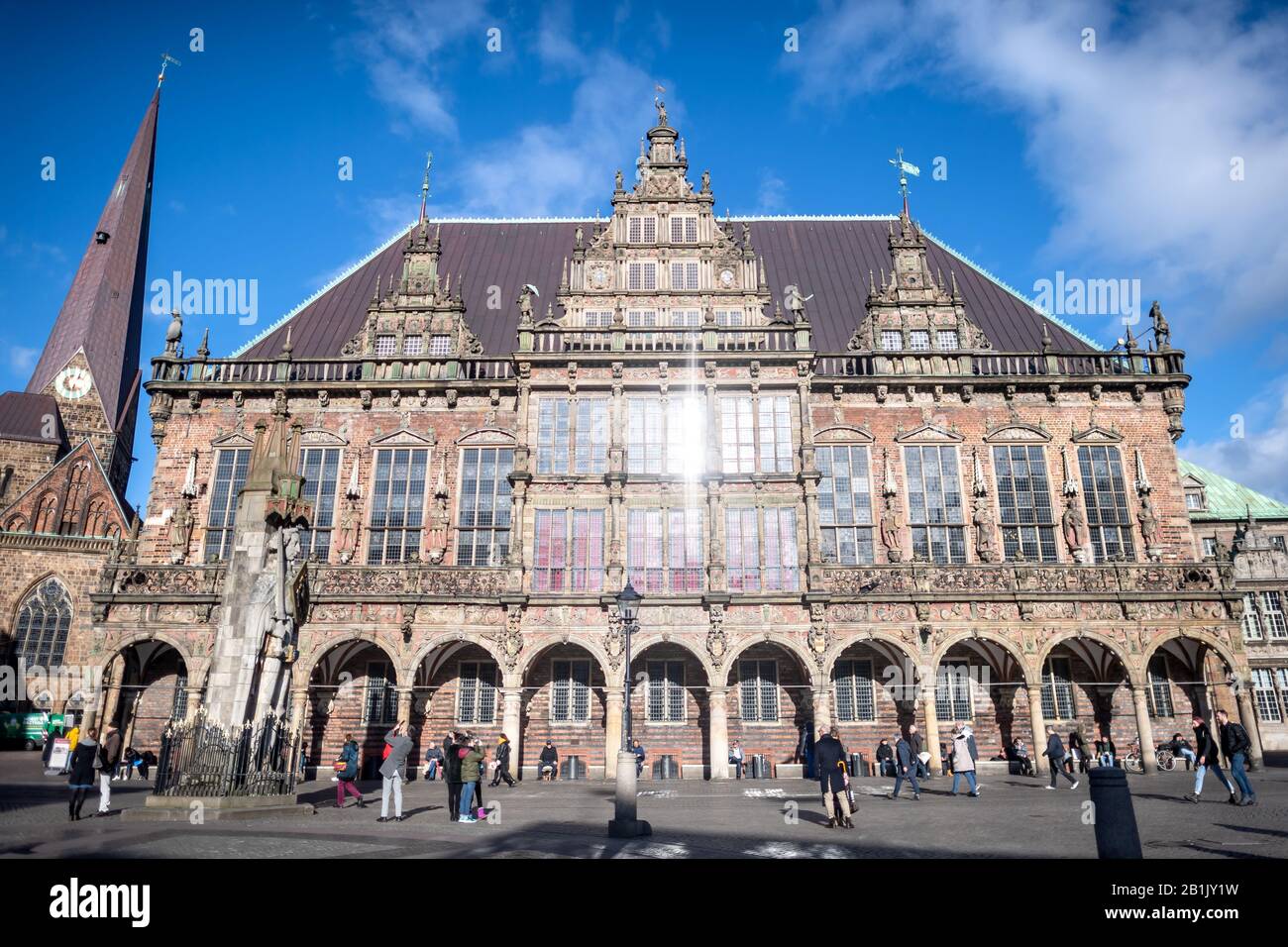 Bremen, Germany. 25th Feb, 2020. People walk past the Bremen town hall ...
