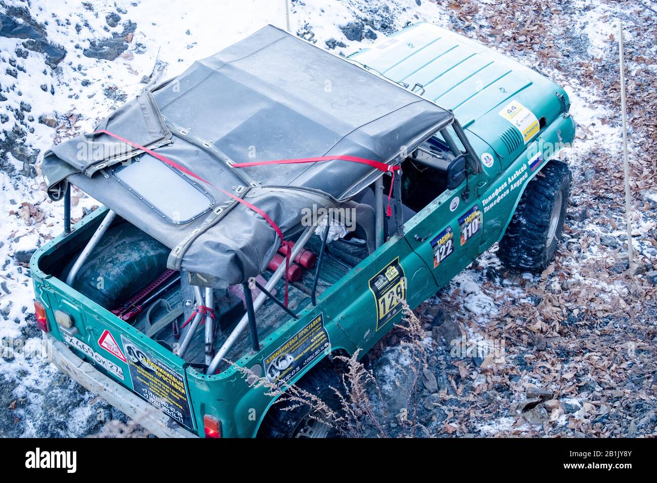 Jeep Suzuki Jimny overcomes obstacles in the forest Stock Photo - Alamy
