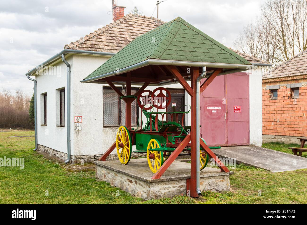 Vintage fire cart exhibited outdoors in front of local volunteer fire ...