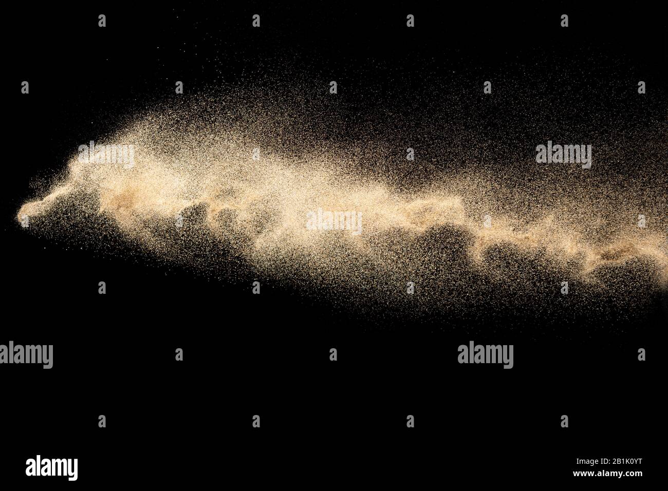 Brown colored sand splash.Dry river sand explosion isolated on black ...