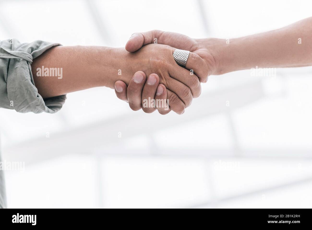 close up. handshake business partners on blurred office background ...
