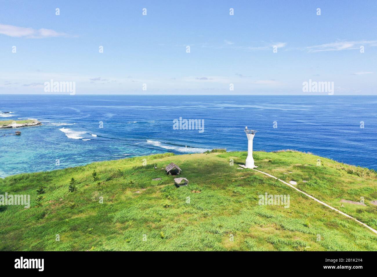Lighthouse on a tropical island, top view. Beautiful landscape with a ...