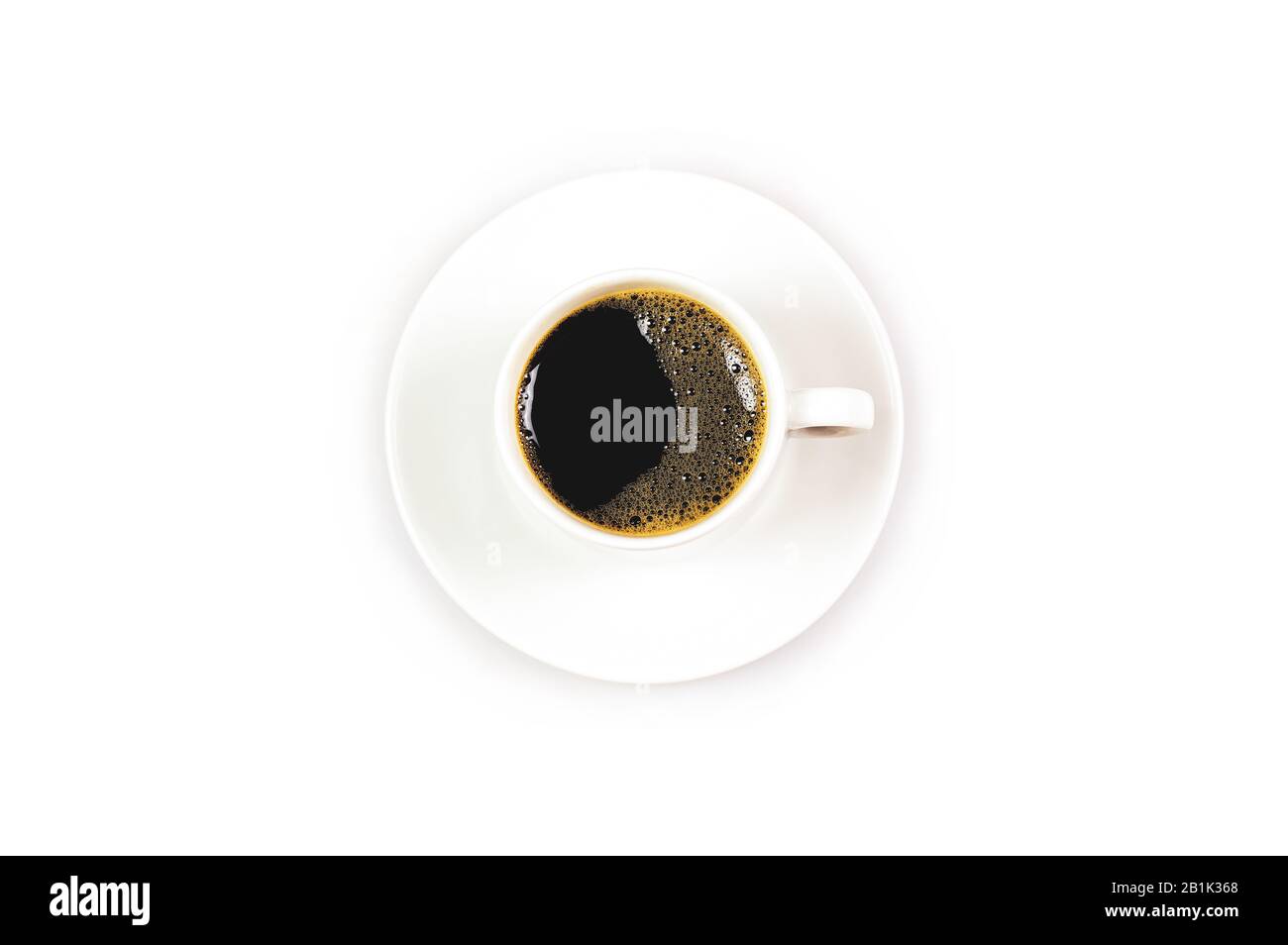 Black coffee without milk with a small foam in a white Cup and saucer ...