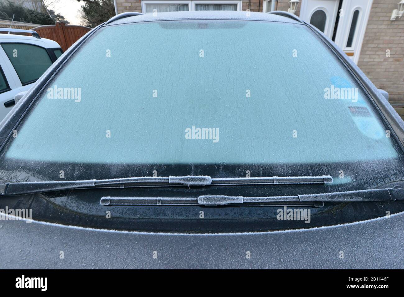 A frozen car windscreen on a winters day in the UK Stock Photo - Alamy