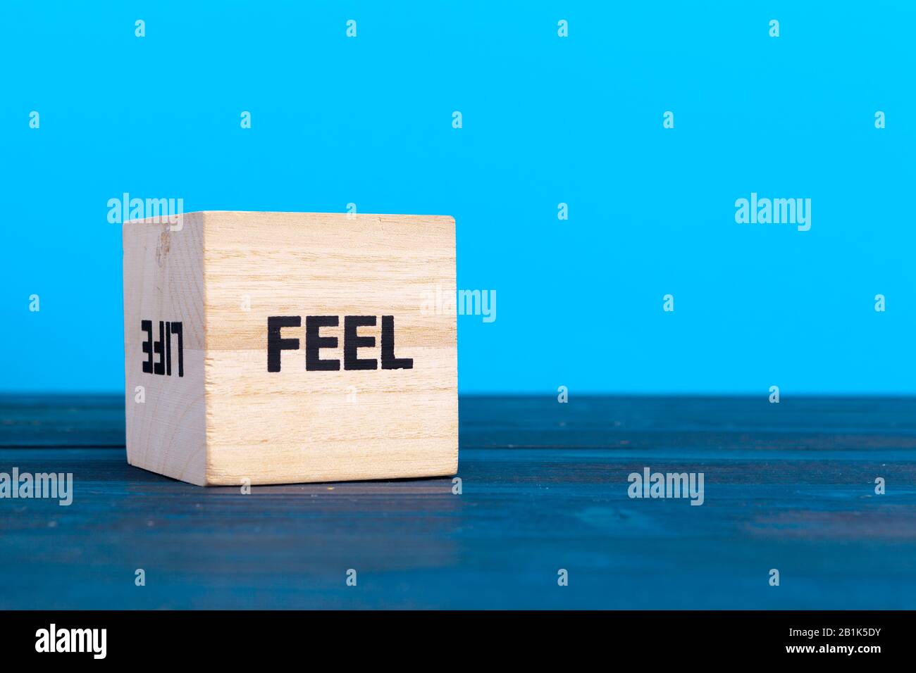 cube wooden block with alphabet building the word feel Stock Photo - Alamy