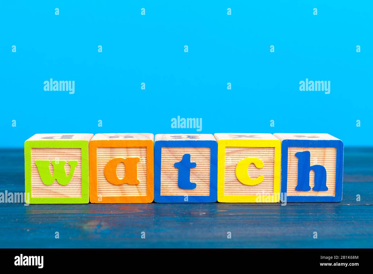 cube wooden block with alphabet building the word watch Stock Photo - Alamy