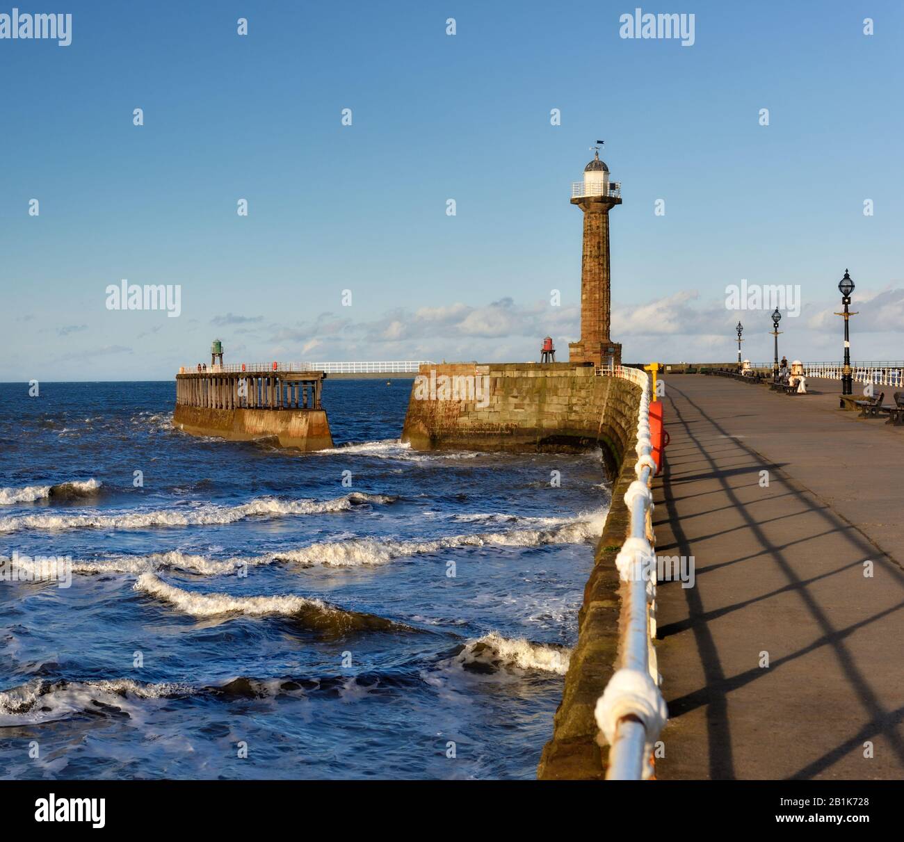 Incoming tide and waves Whitby lighthouse,North Yorkshire,England,UK ...