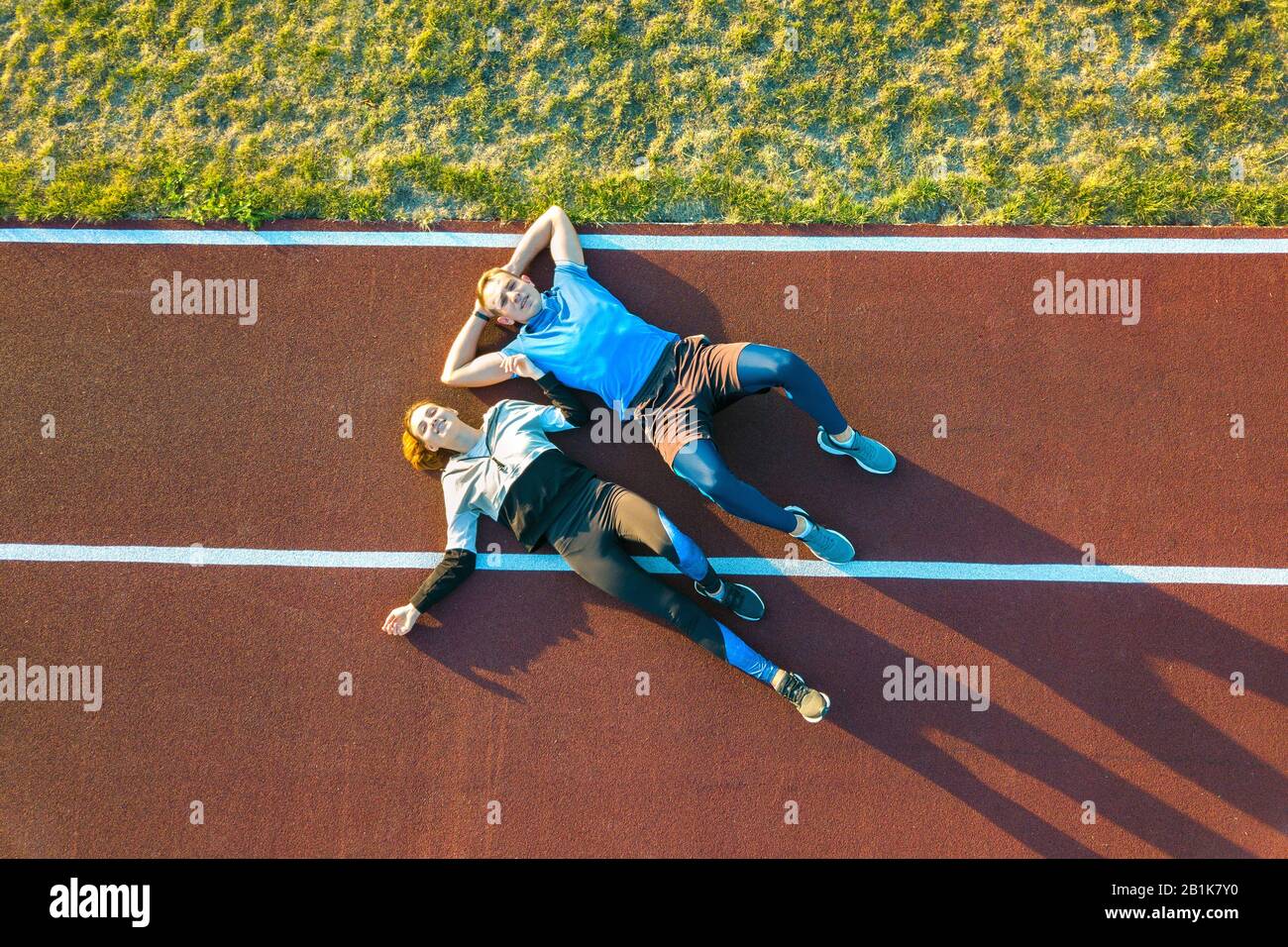 Top down aerial view of two young people sportsman and sportswoman ...