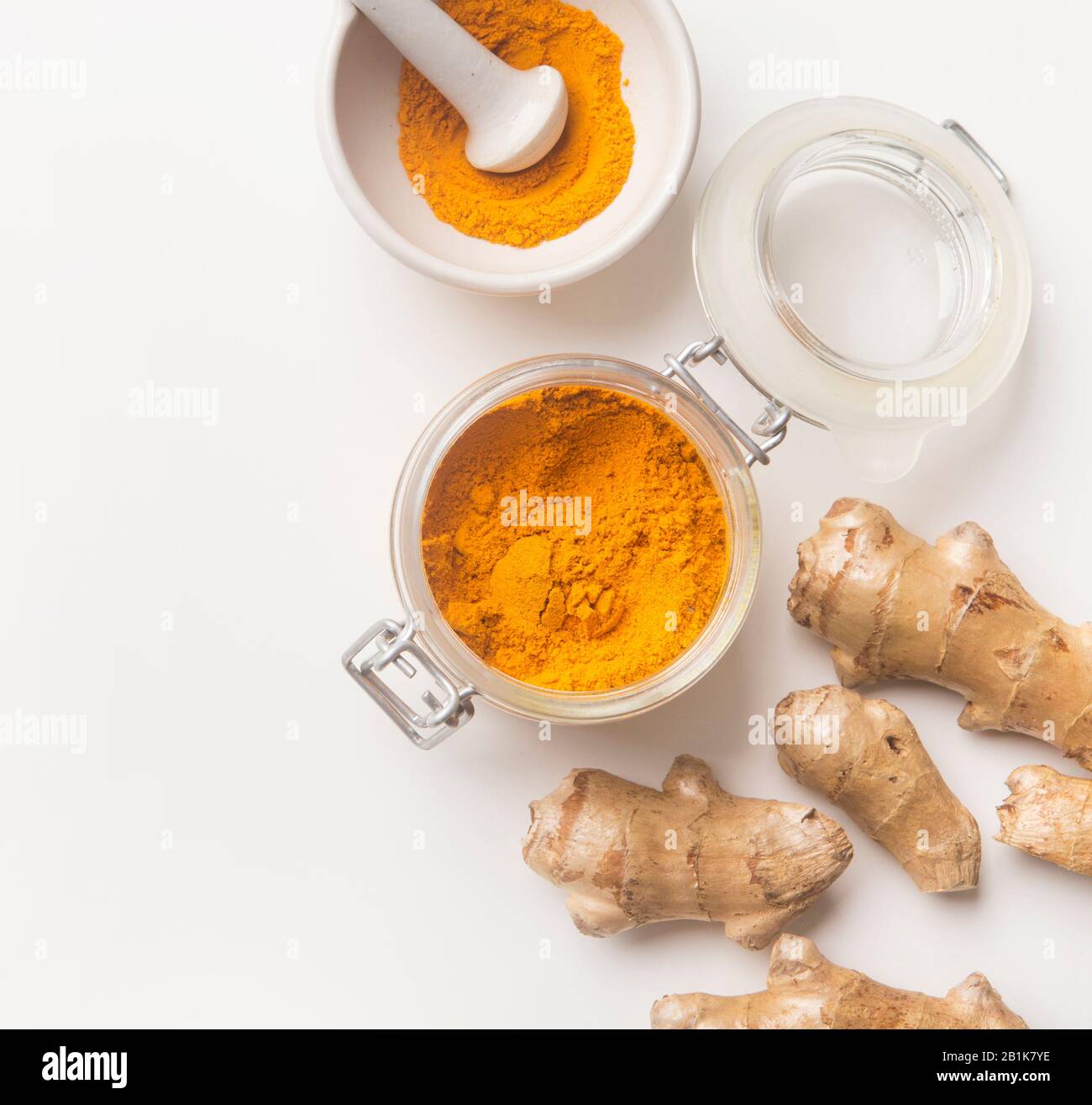 Turmeric root and turmeric powder on white Stock Photo - Alamy