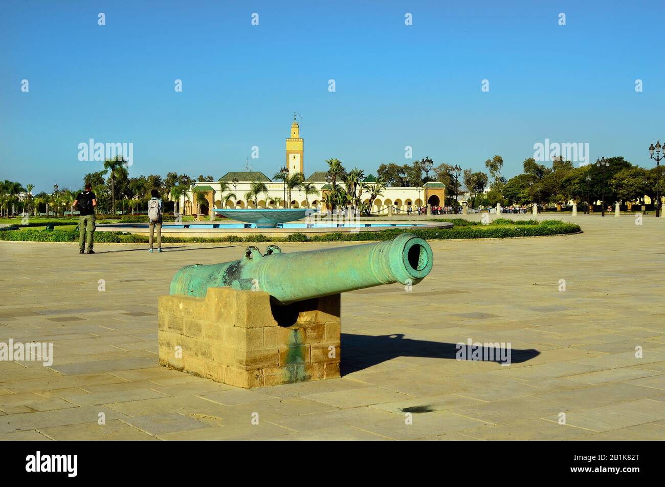 Morocco, Rabat, medieval cannon and fountain on square with mosque El ...