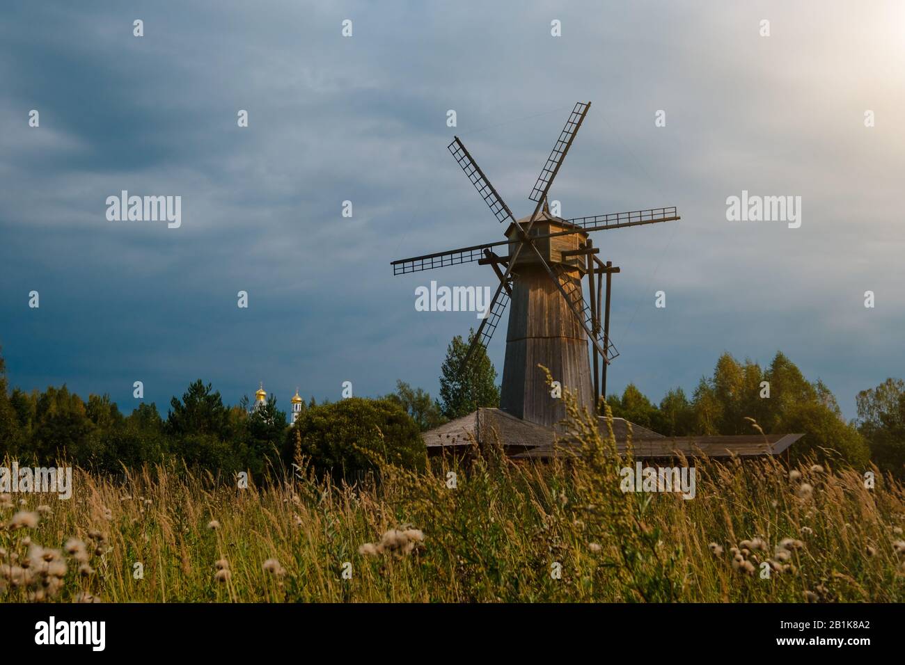 Old wooden windmill in the field. Historical heritage at the Museum of ...
