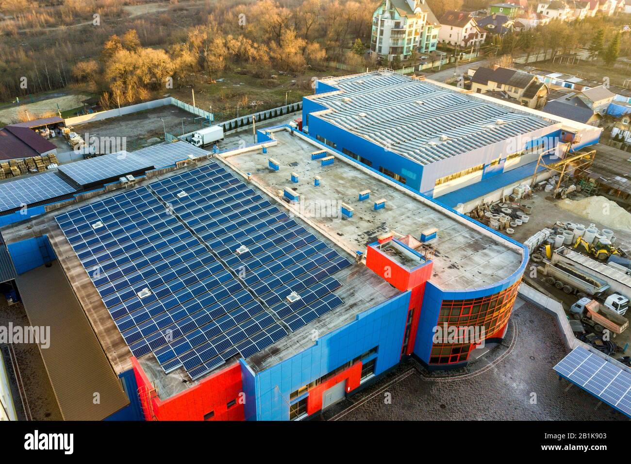 Aerial view of many photo voltaic solar panels mounted of industrial ...