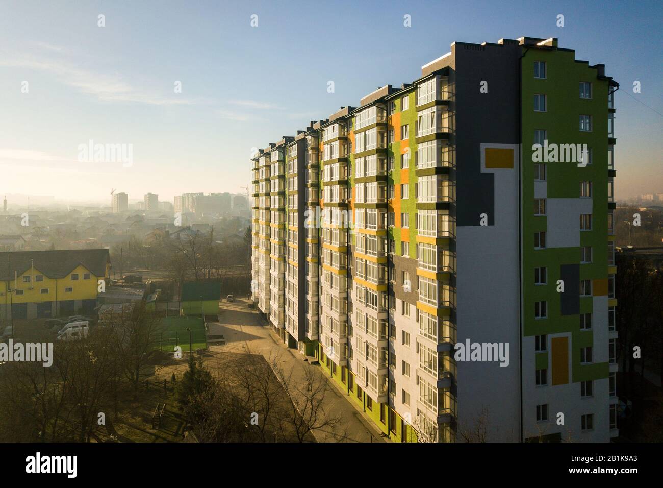 Aerial view of a tall residential apartment building with many windows ...
